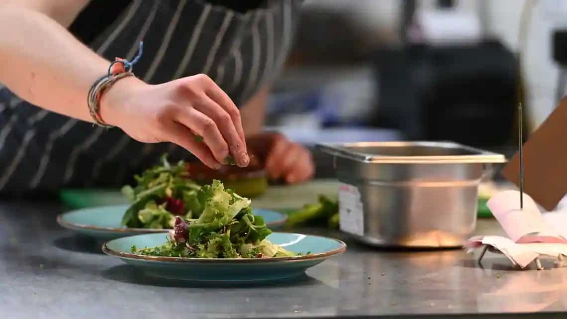 This restaurant menu lists the carbon footprint of each dish